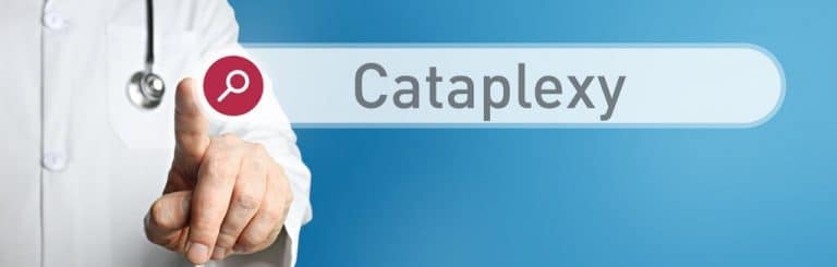 Cataplexy. Doctor in smock points with his finger to a search box. The ...